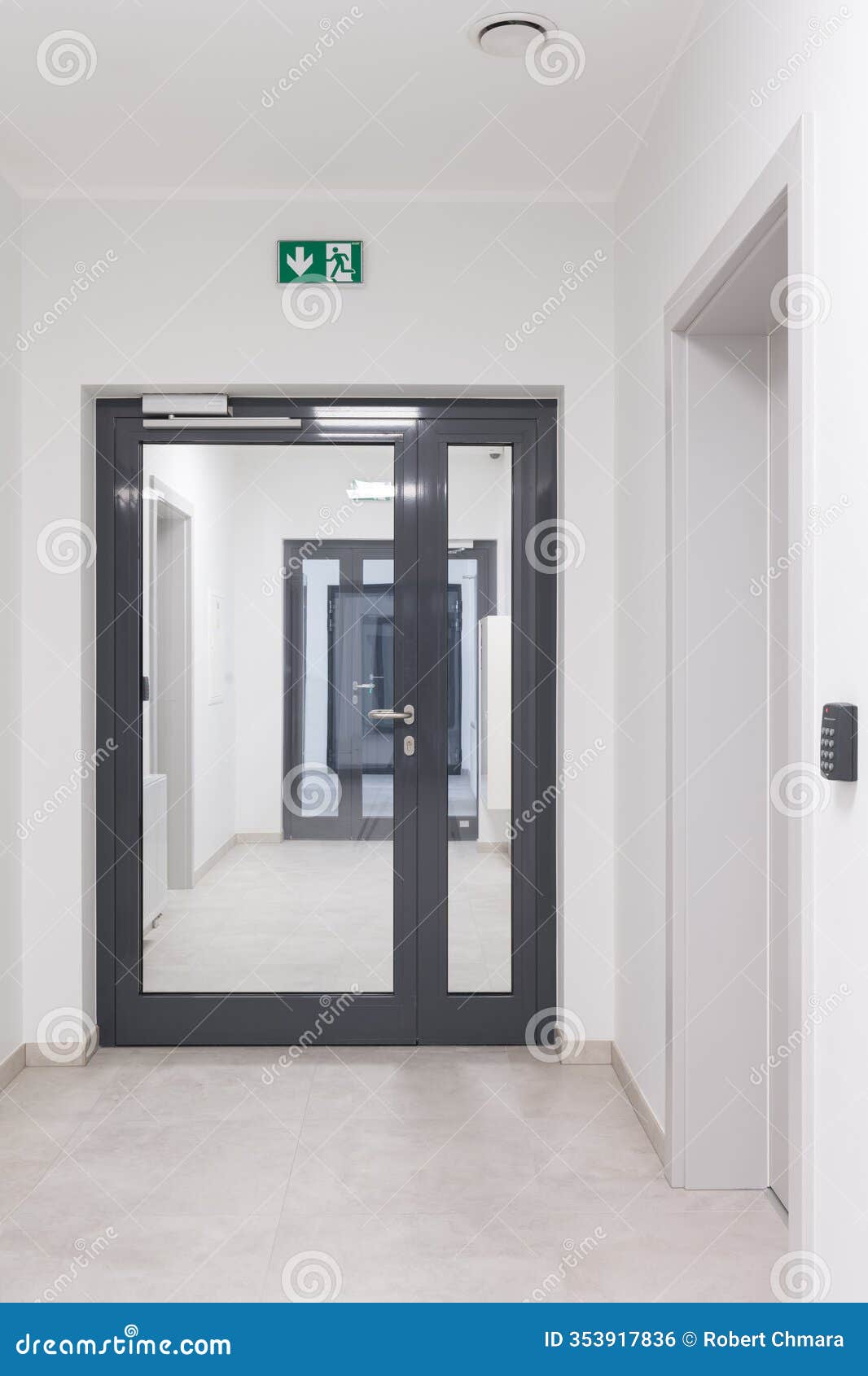 Modern Hallway with Emergency Exit Door and Access Control Stock Photo ...