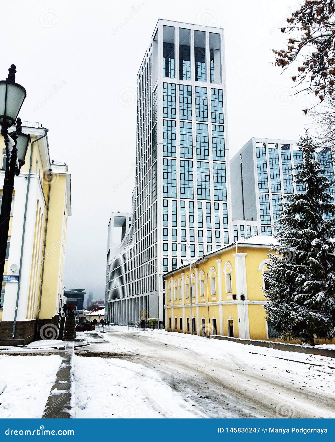Modern High-rise Building on Background of Historic Old Buildings ...