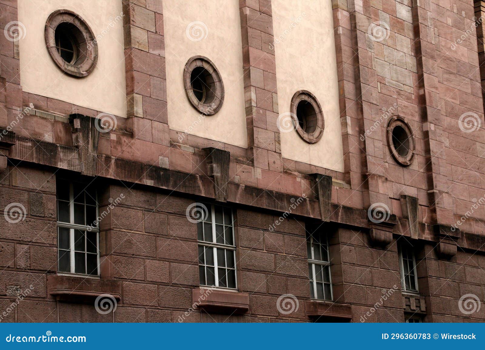 A Large Tall Building with Windows that Has Several Round Openings ...