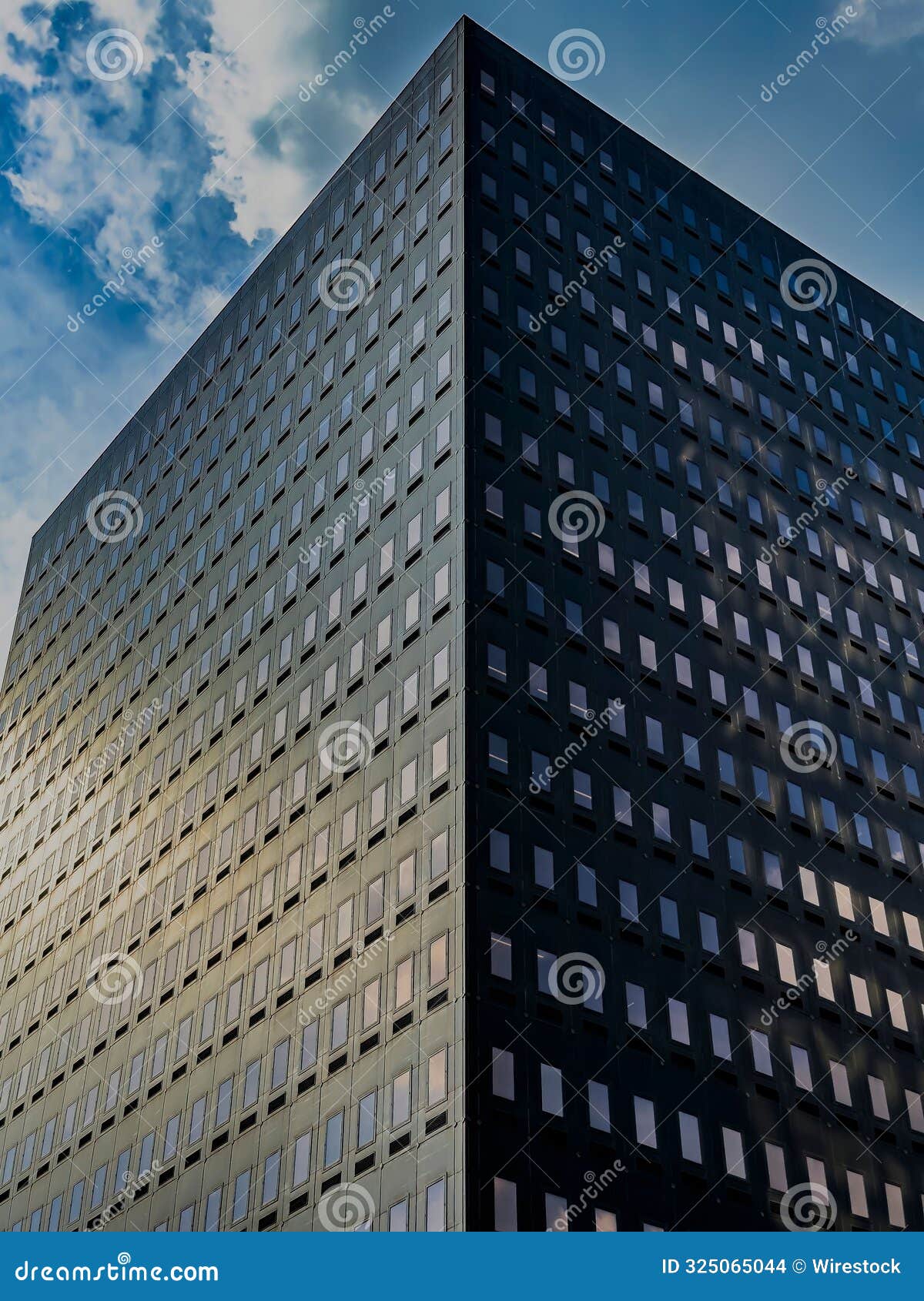 Modern High-rise Office Building with Reflective Windows Against a ...