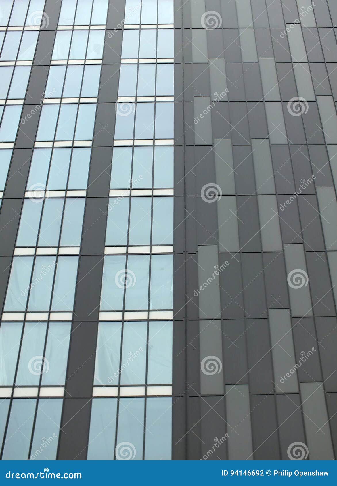 Modern Highrise Building with Grey Cladding and Vertical Windows Stock ...
