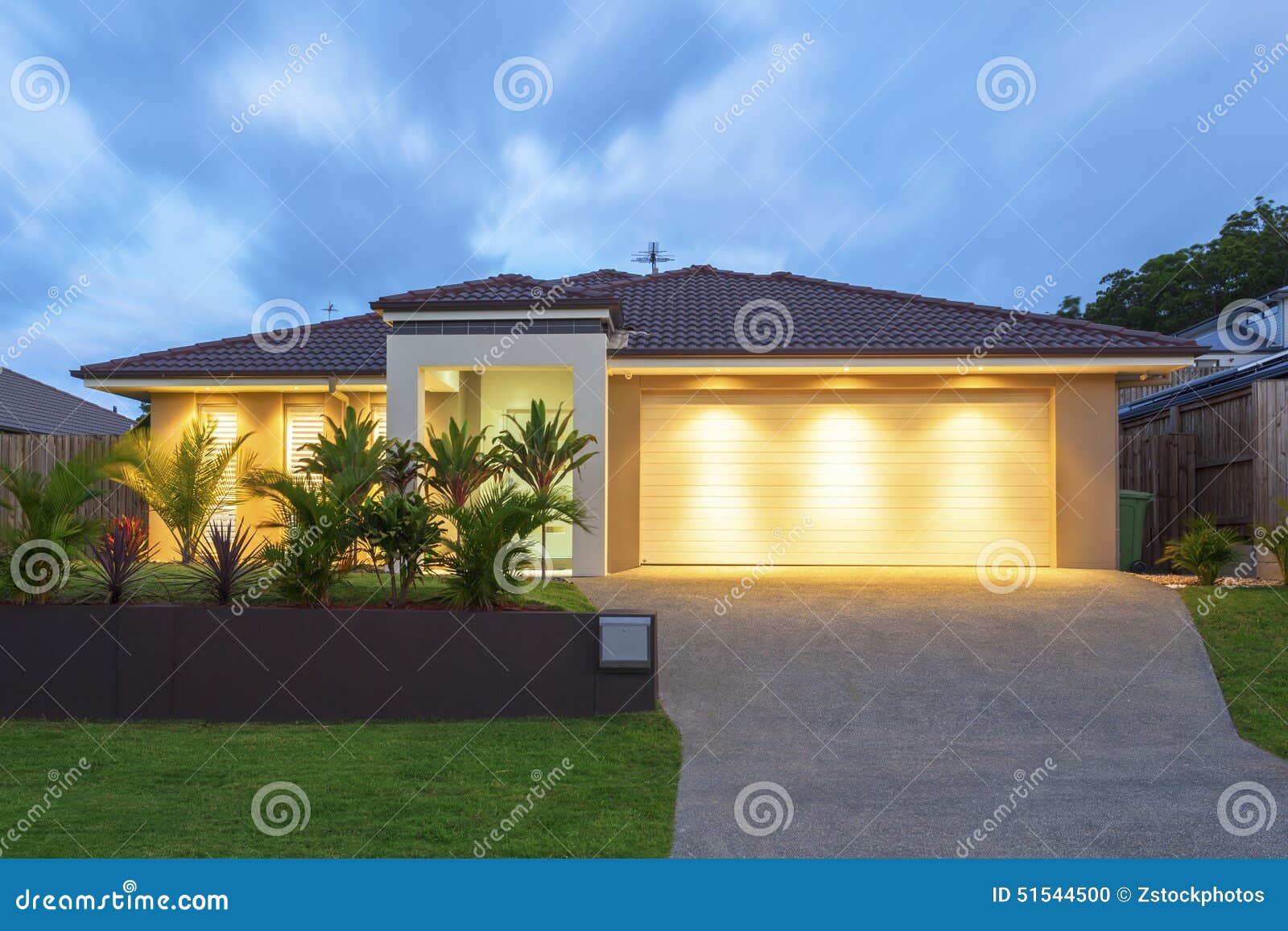 Modern home at dusk stock photo. Image of dusk, night - 51544500
