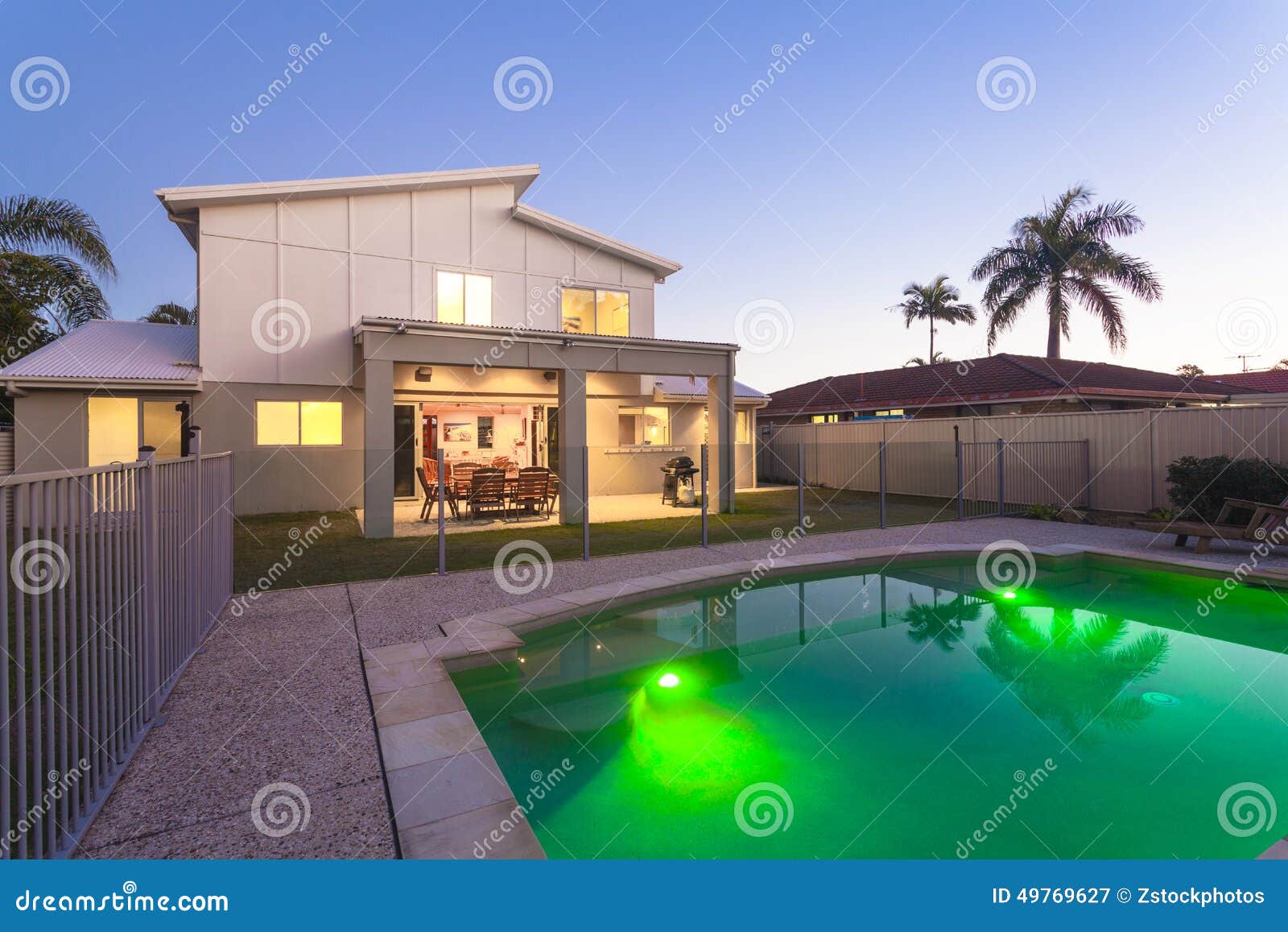 Modern Home Exterior at Dusk Stock Image - Image of pool, property ...