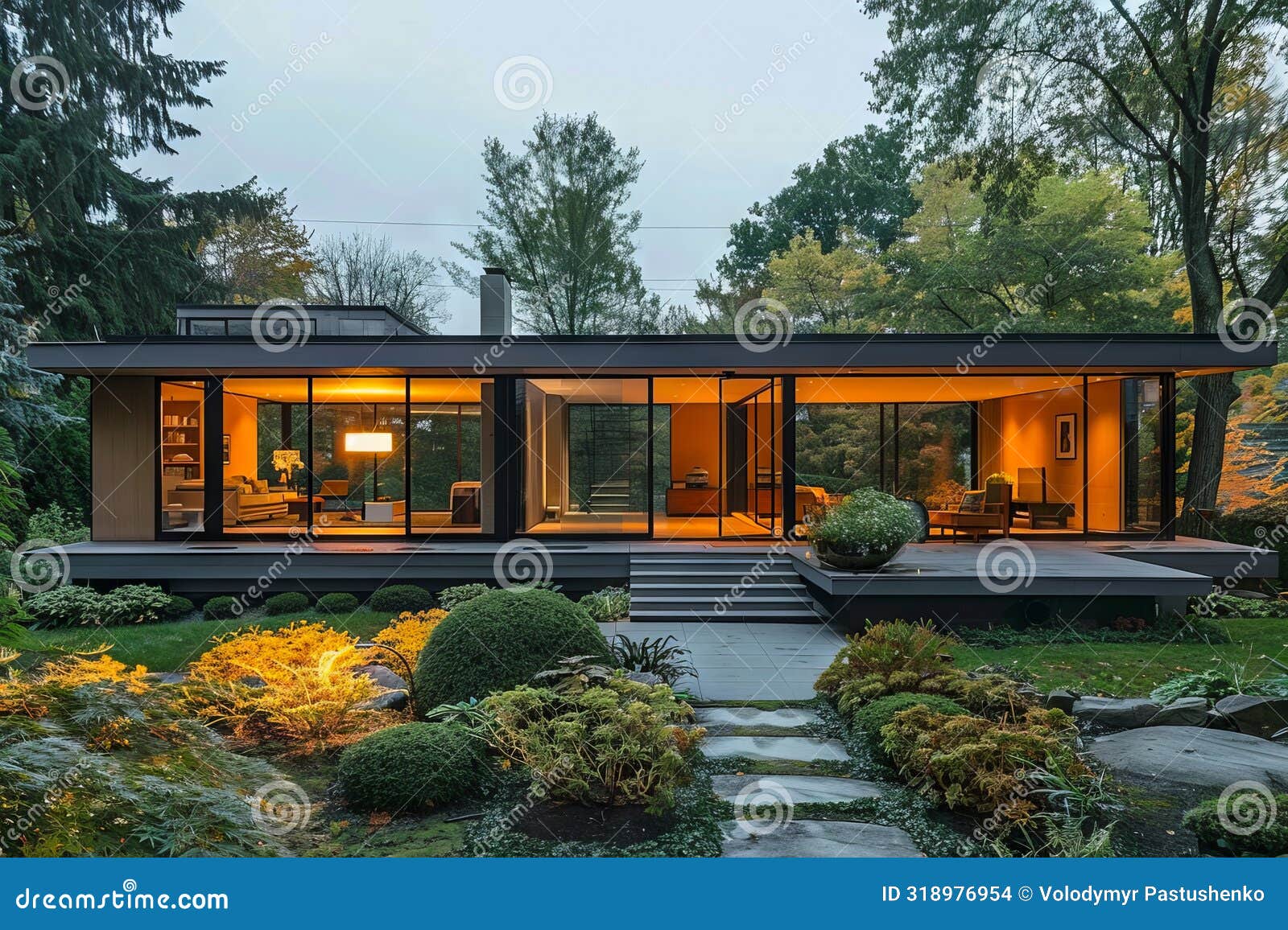 A Modern Home with Glass Walls and Stone Walkways Stock Photo - Image ...