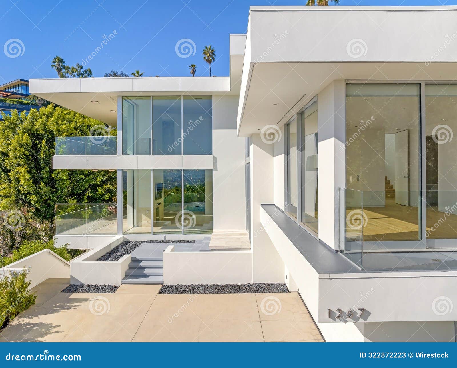 Modern House Surrounded by Lush Greenery with Numerous Windows Stock ...