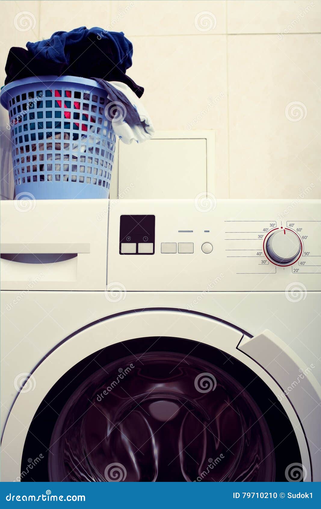 Modern Household Washing Machine and a Pile of Dirty Laundry Stock ...