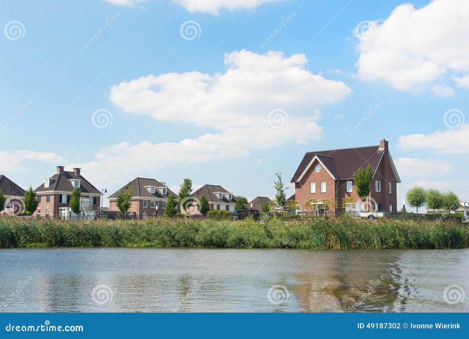 Modern houses near river stock photo. Image of water - 49187302