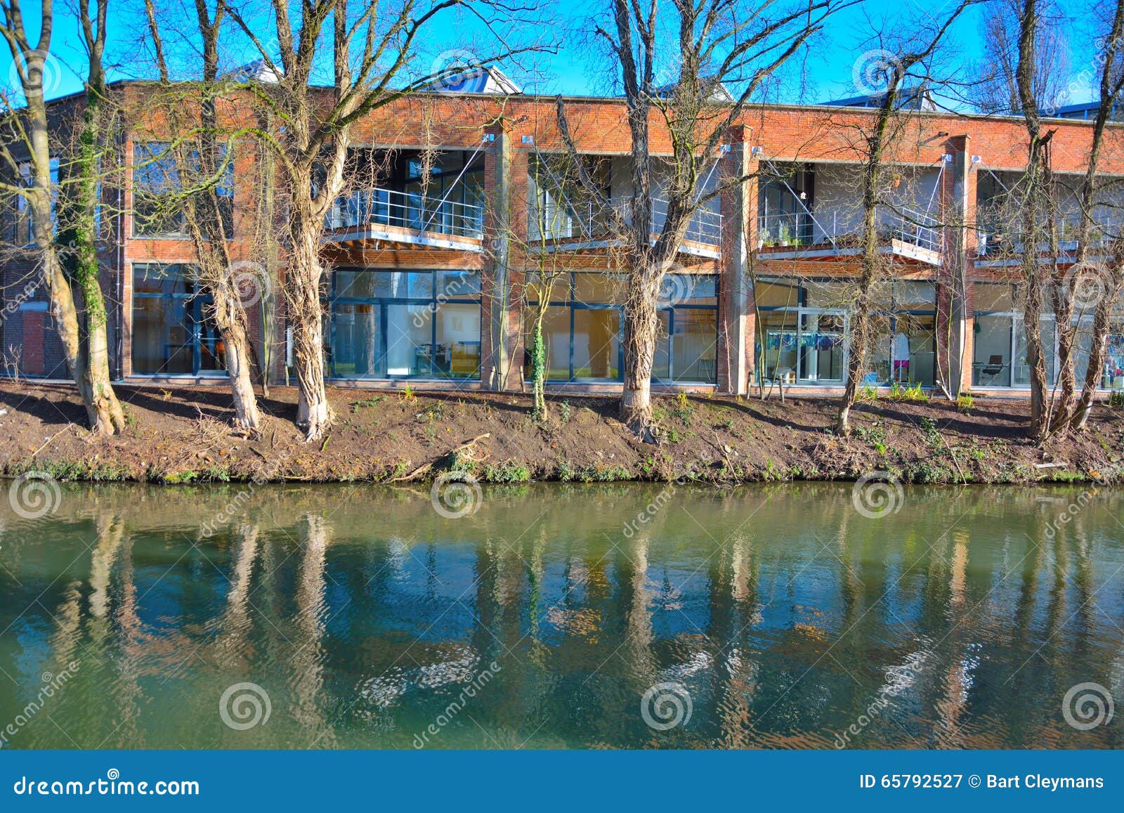 Modern Housing in Front of a River Stock Image - Image of cityscape ...