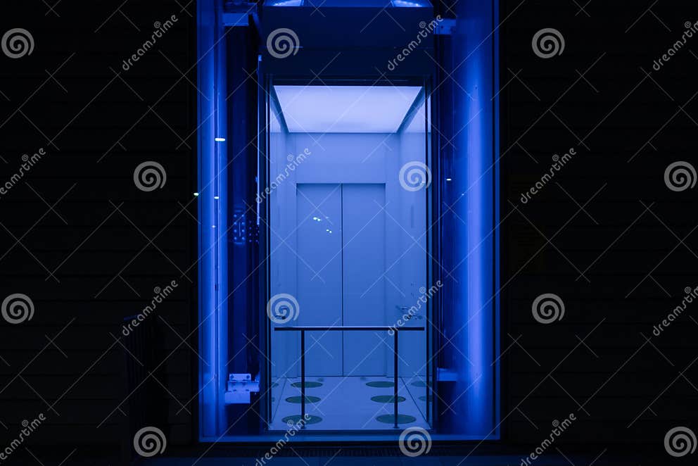 Modern Illuminated Elevator with Blue Lighting Stock Image - Image of ...