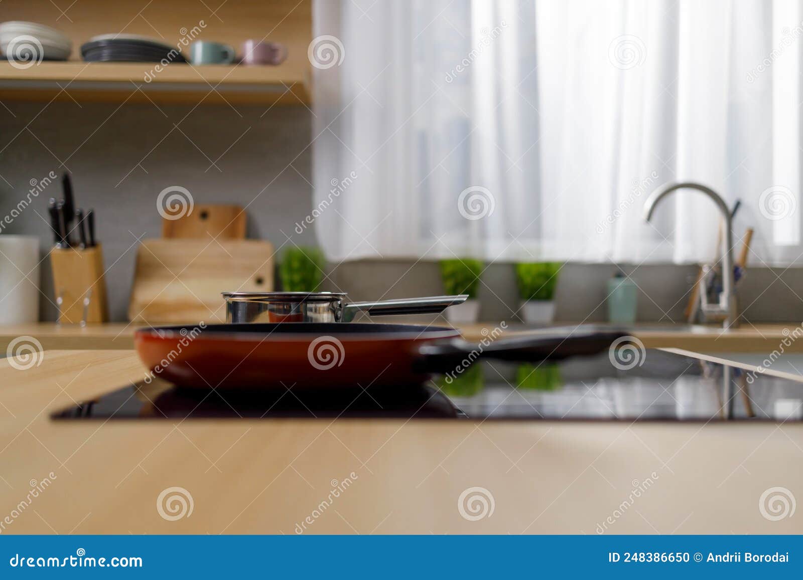 Modern Induction Hob and Cookware in the Kitchen. Stock Photo - Image ...