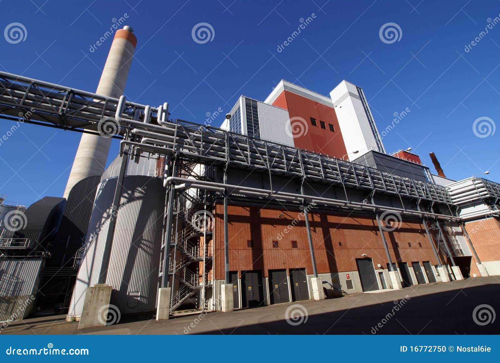 Modern Industrial Factory Against Blue Sky Stock Photo - Image of plant ...