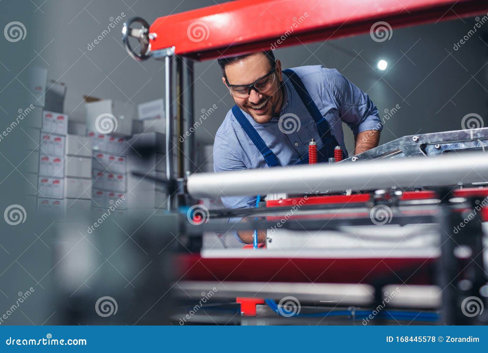 Modern Industrial Machine Operator Working in Factory. Worker on the ...