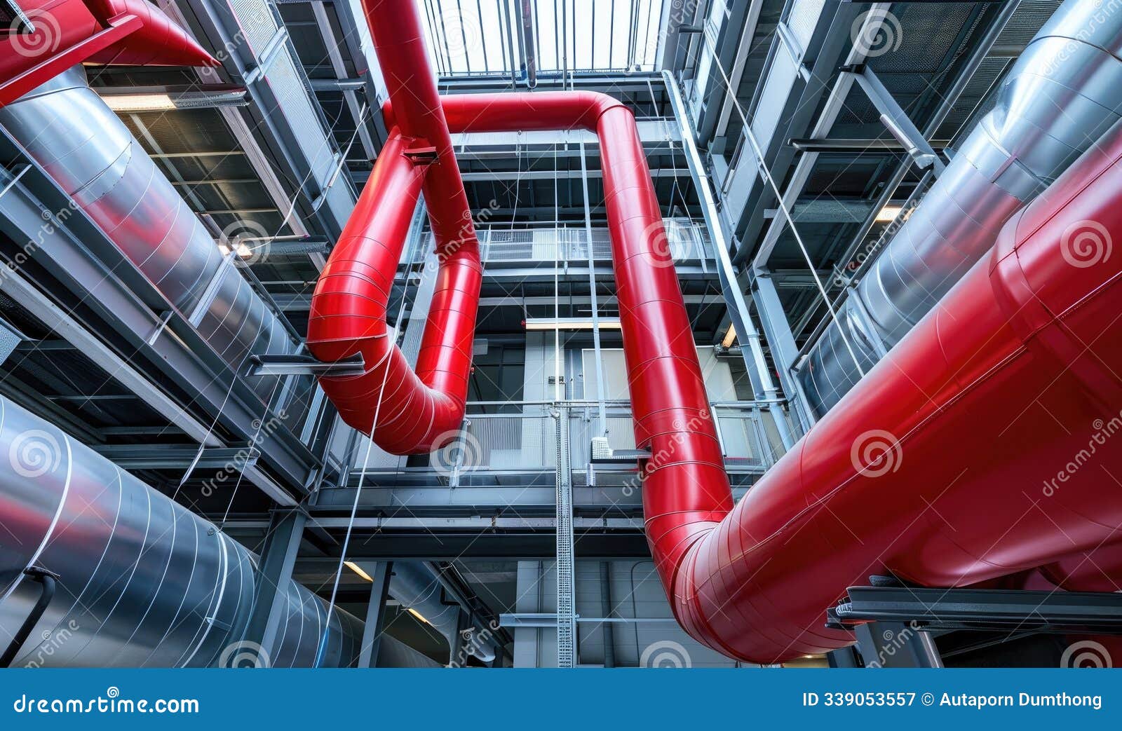 Modern Industrial Ventilation System with Red Pipes Inside a Large Facility, Showcasing ...