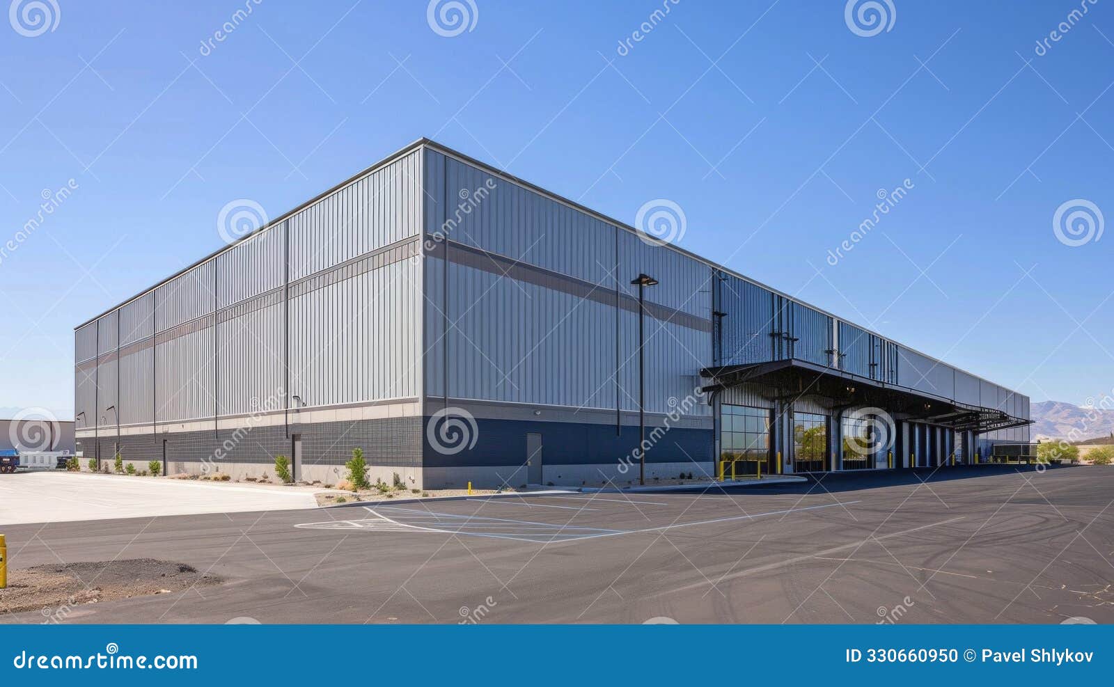 Modern Industrial Warehouse at Sunset with Clear Sky Stock Photo ...