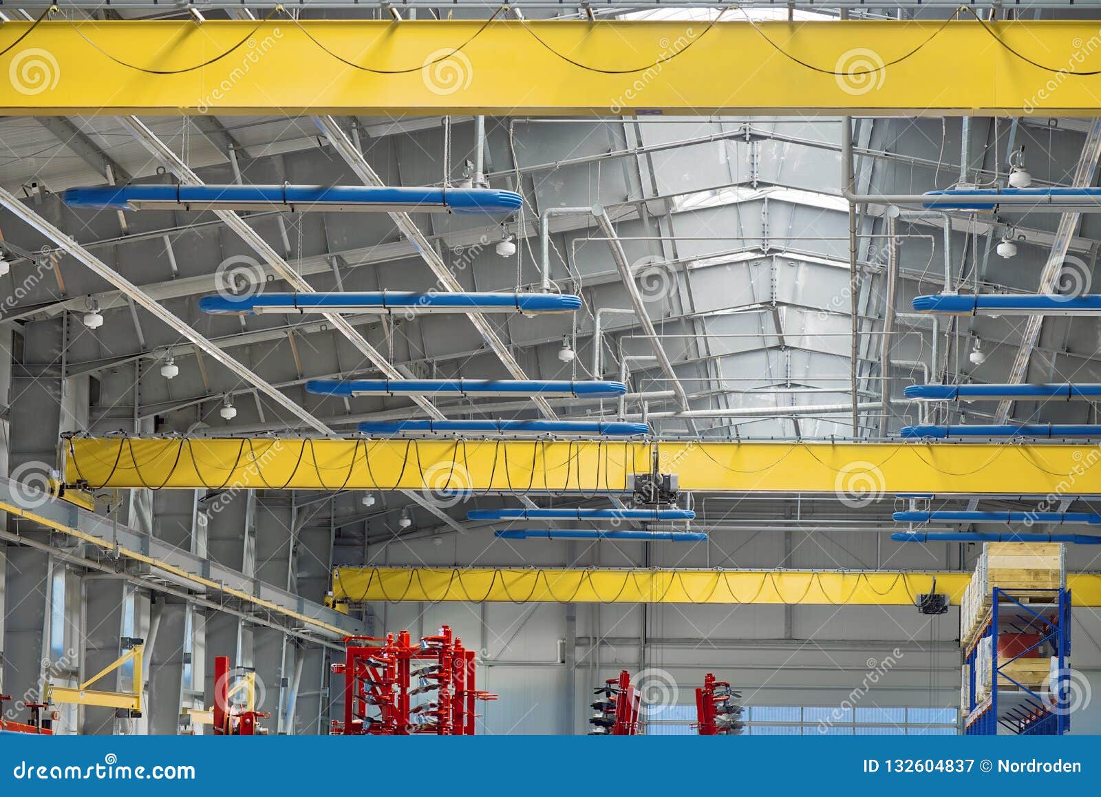 A Modern Industrial Workshop, Three Overhead Cranes Under the Ceiling ...