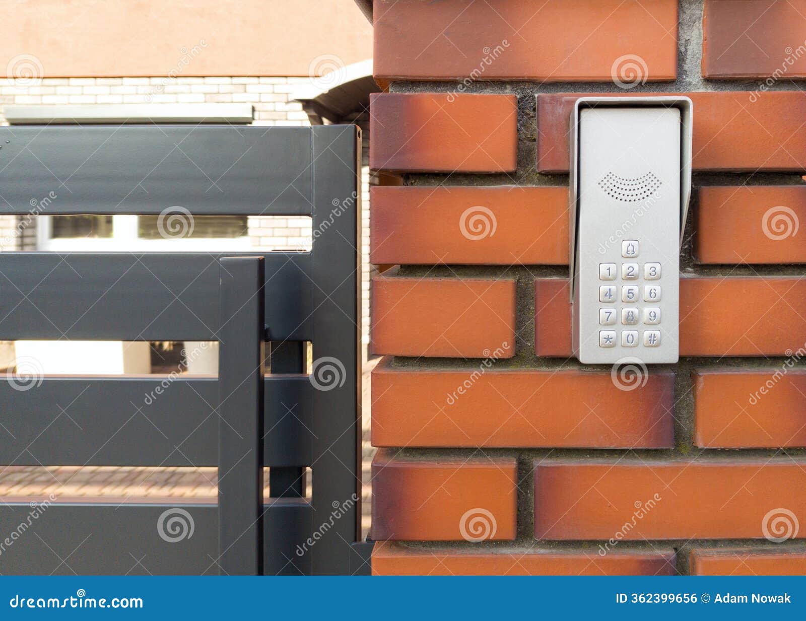 Modern Intercom Keypad on Brick Wall by Metal Gate Stock Photo - Image ...