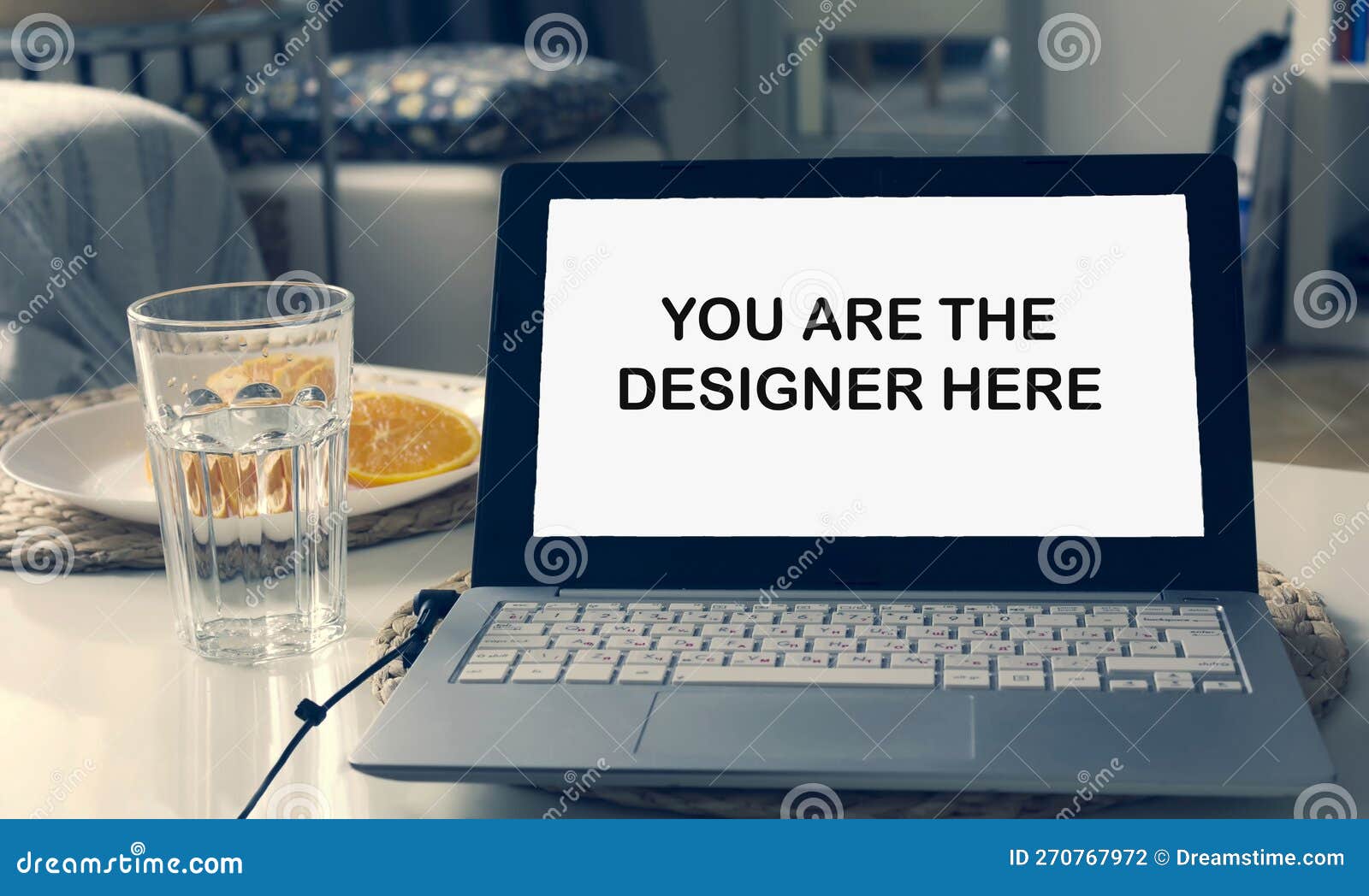 In a Modern Interior, a Laptop is on the Table. Text on Laptop Screen ...