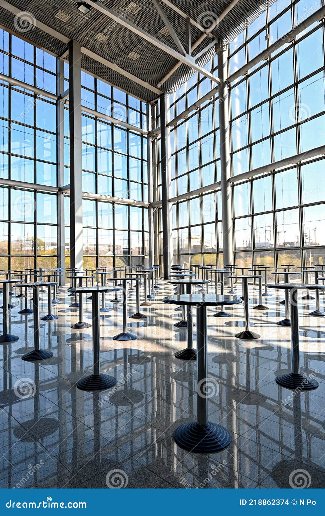 Modern Interior with Panoramic Windows and Tables in Row on Shiny Stone ...