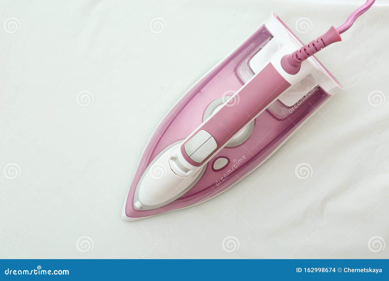 Modern Iron on Light Fabric. Laundry Day Stock Photo - Image of modern ...