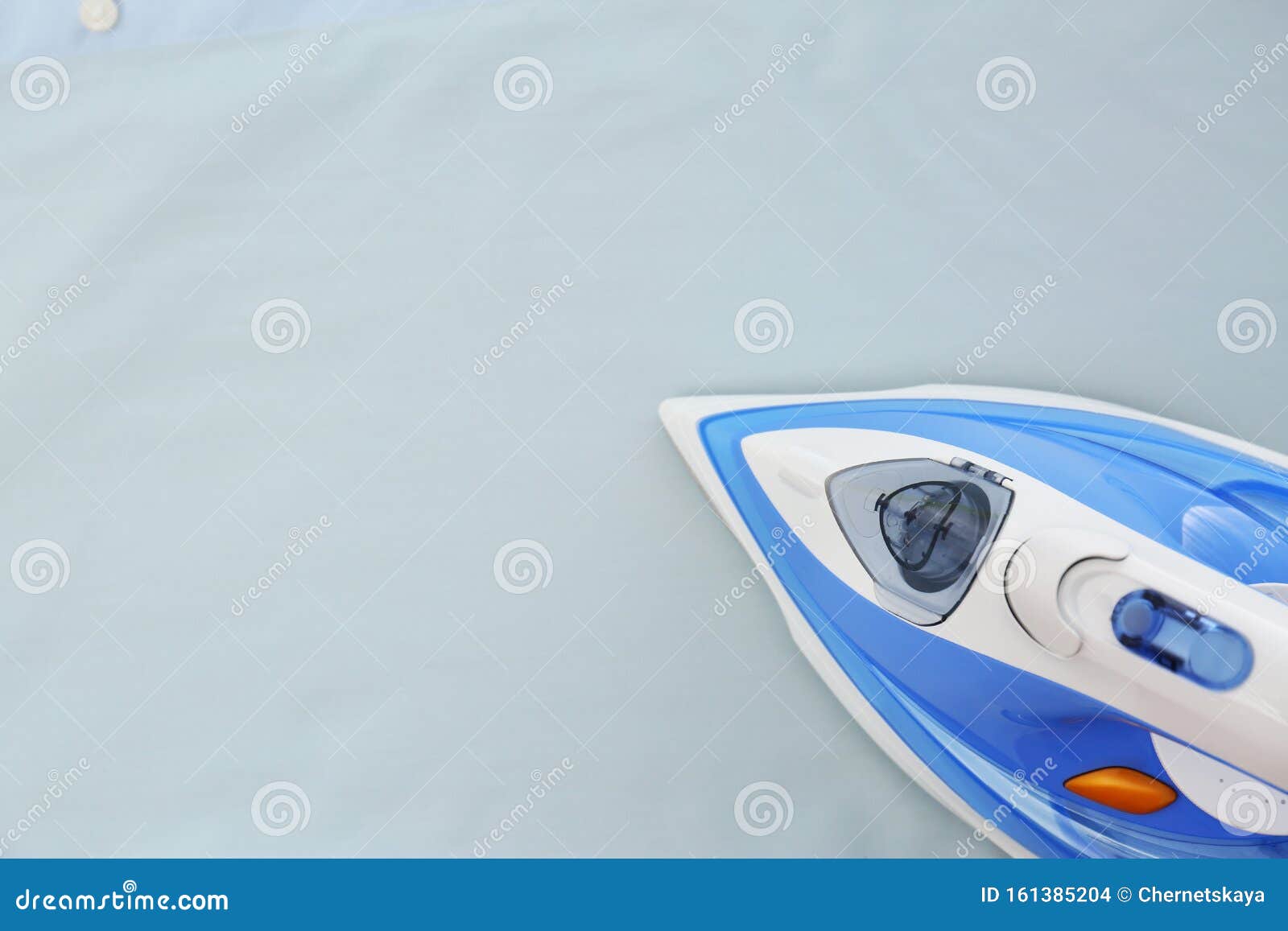 Modern Iron on Light Fabric, Top View. Laundry Day Stock Photo - Image ...