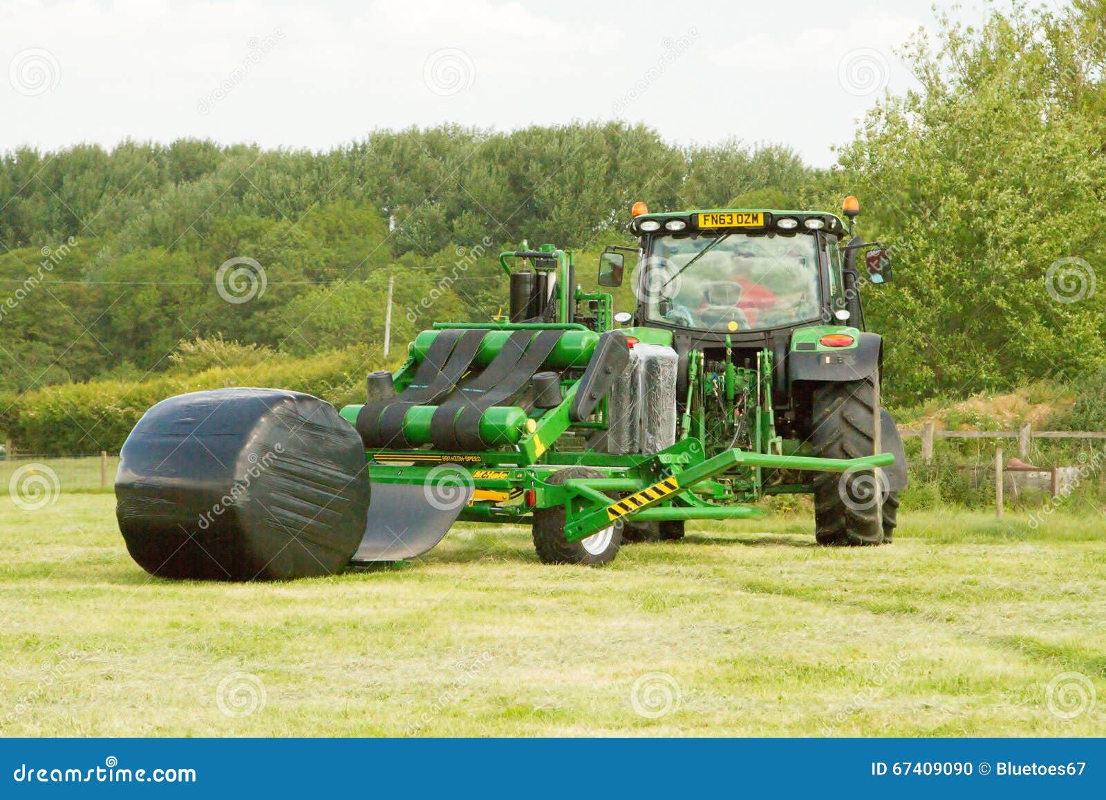 Wrapping A Hay Bale With Plastic Wrap Editorial Image | CartoonDealer ...