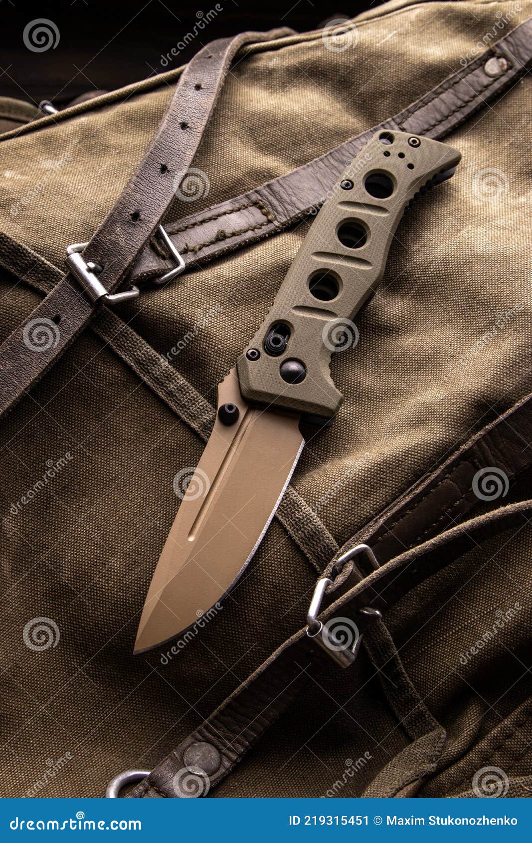 Modern Khaki Folding Knife on a Rough Canvas Backpack Stock Image ...