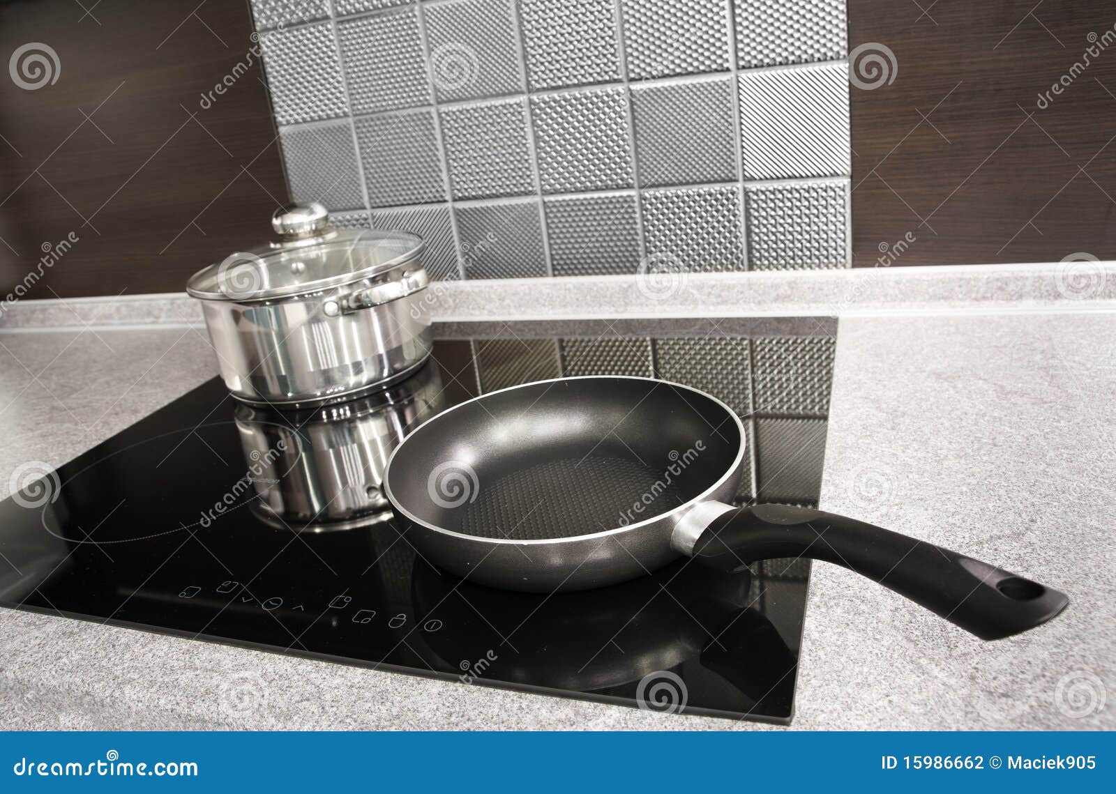 Modern Kitchen Appliances. Pot and Pan on a Cooker Stock Photo - Image ...
