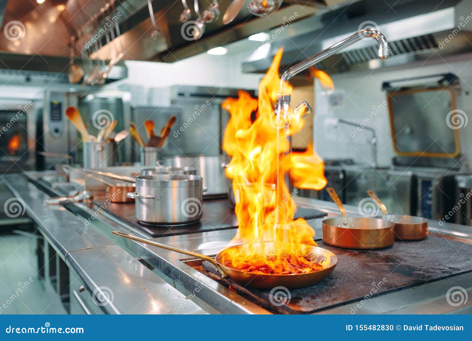 Modern Kitchen. Cooks Prepare Meals on the Stove in the Kitchen of the ...