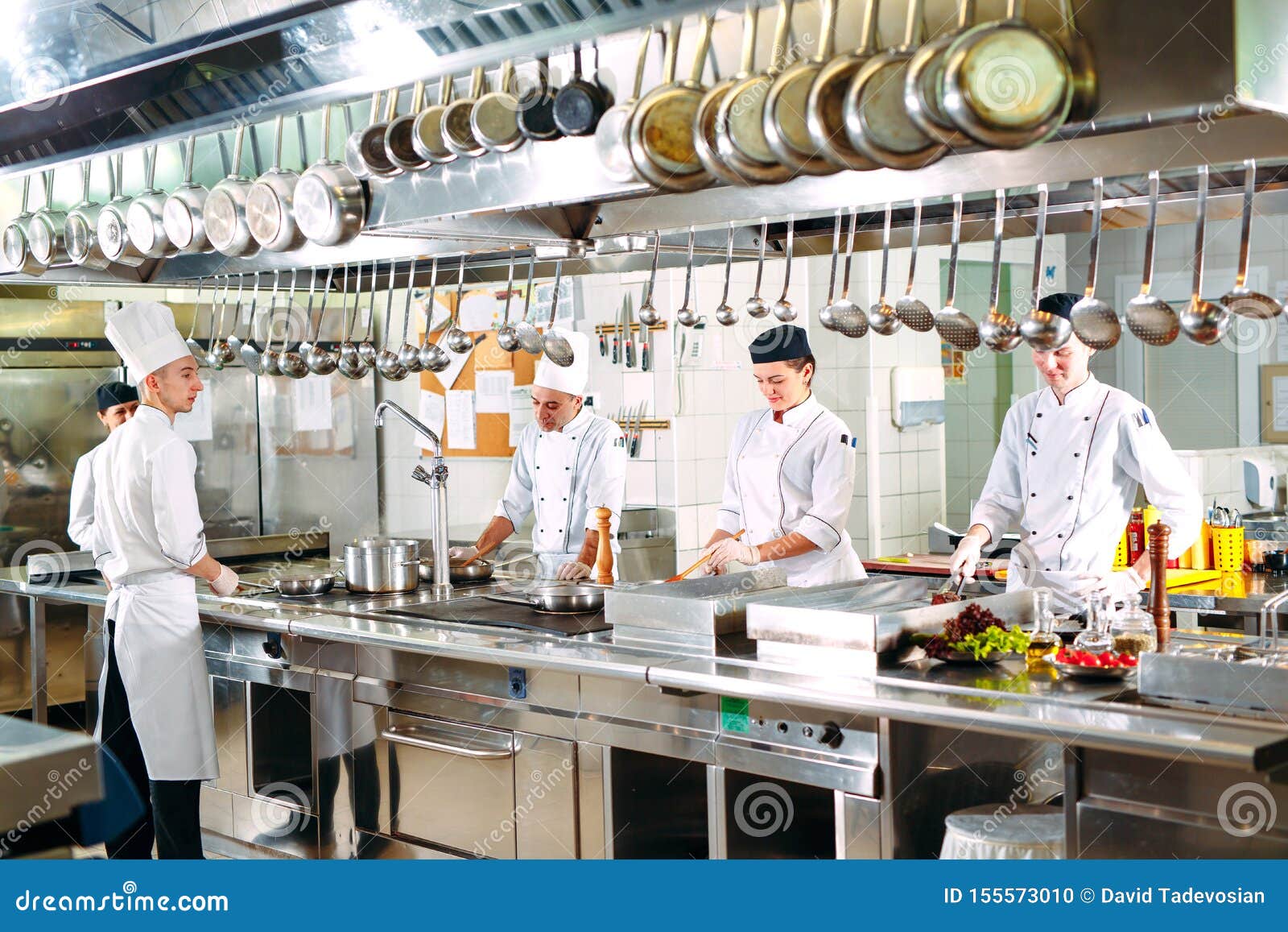 Modern Kitchen. Cooks Prepare Meals on the Stove in the Kitchen of the ...