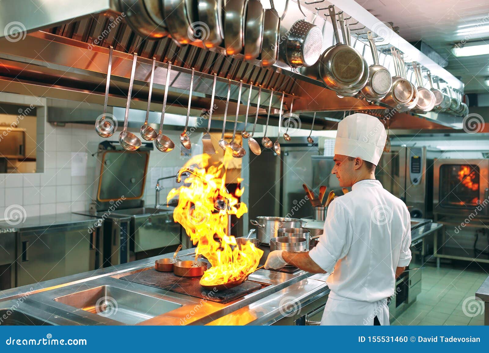 Modern Kitchen. Cooks Prepare Meals on the Stove in the Kitchen of the ...