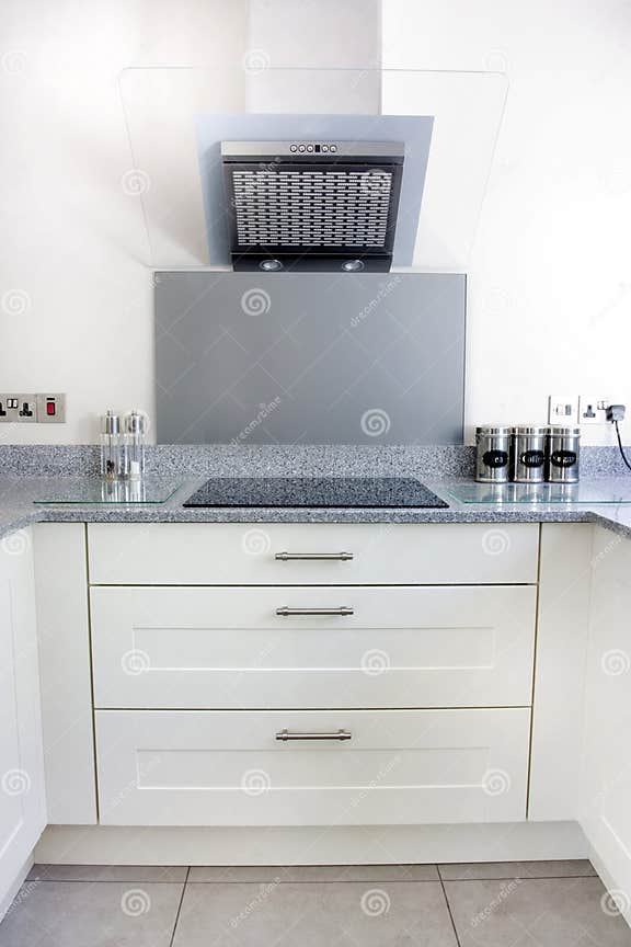 Modern Kitchen Hob and Extractor Fan Stock Photo - Image of macro ...