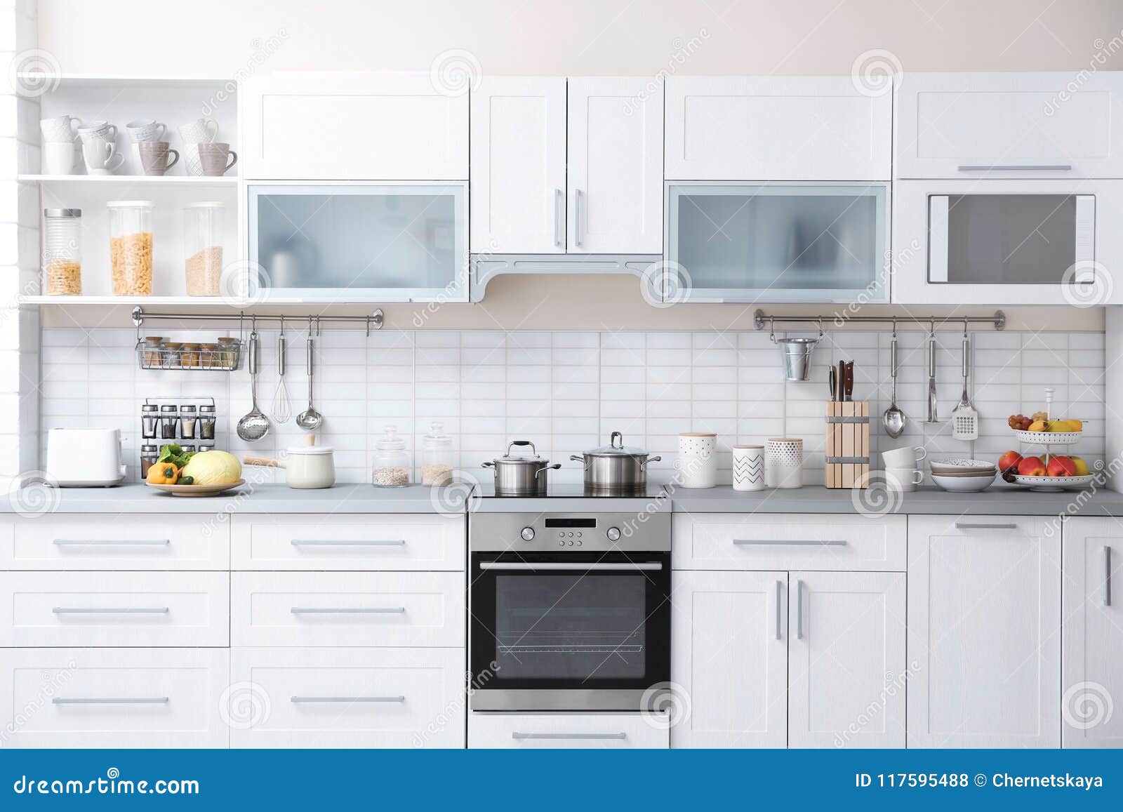 Modern Kitchen Interior with Houseware Stock Photo - Image of casserole ...