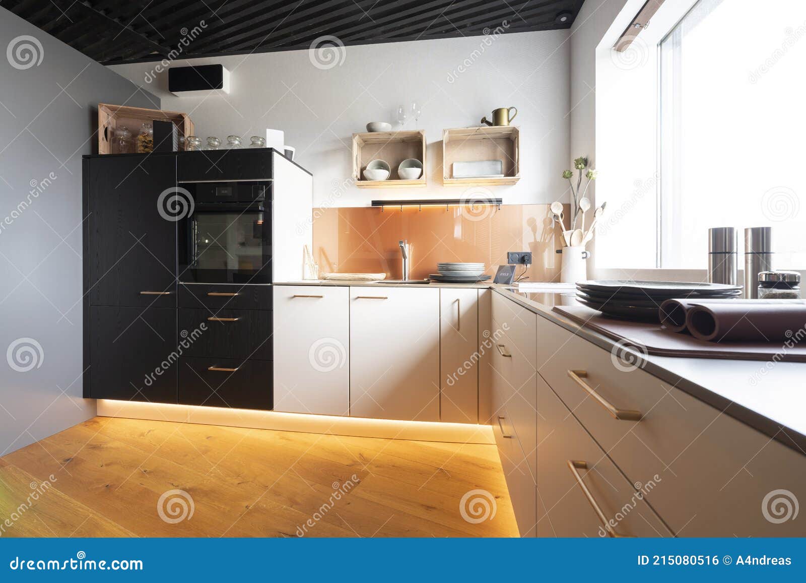 Modern Kitchen with Led Illuminated Plinth, Wooden Floor Stock Photo ...