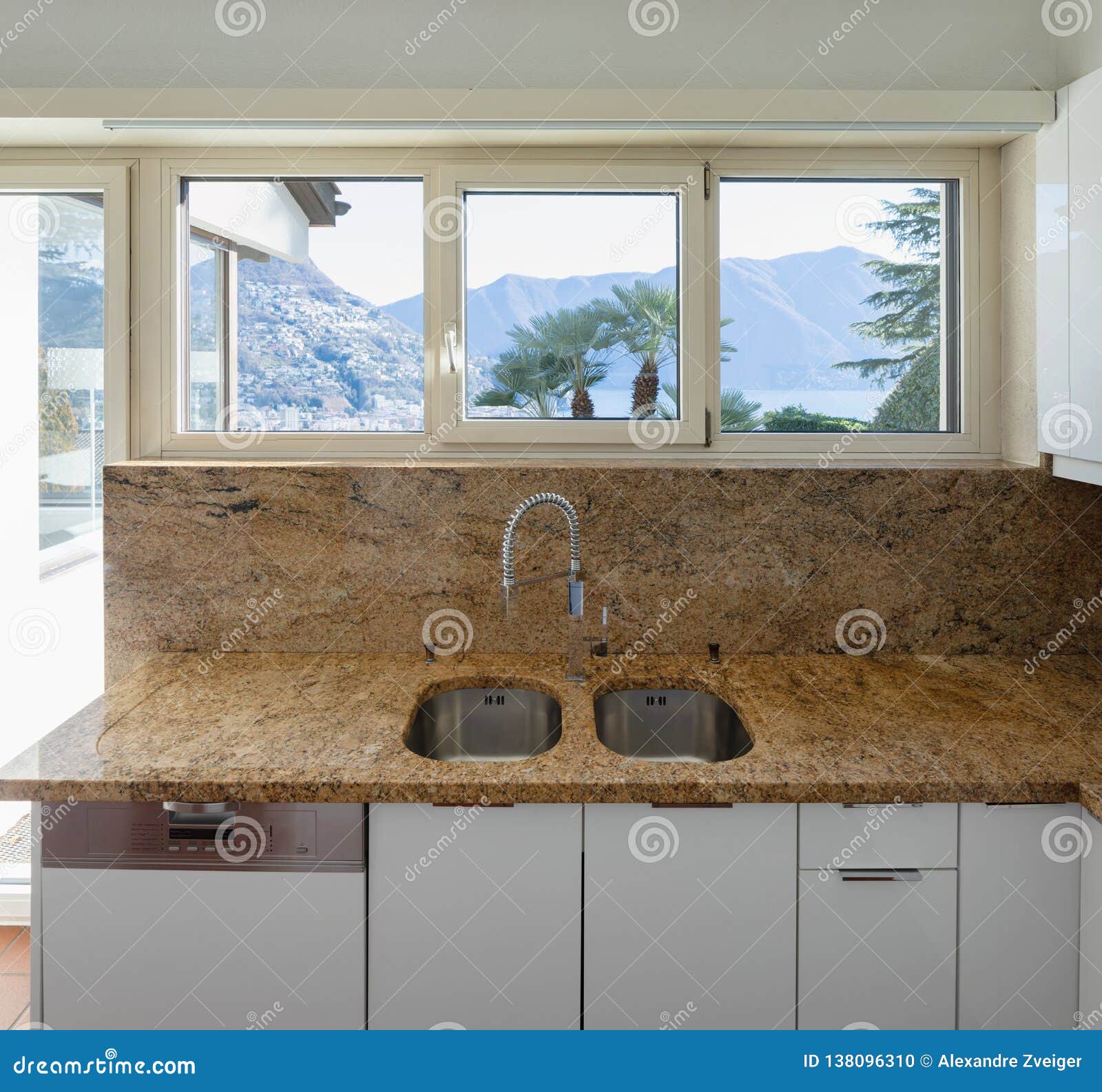 Modern Kitchen with Marble Top and Lake View Stock Photo - Image of ...