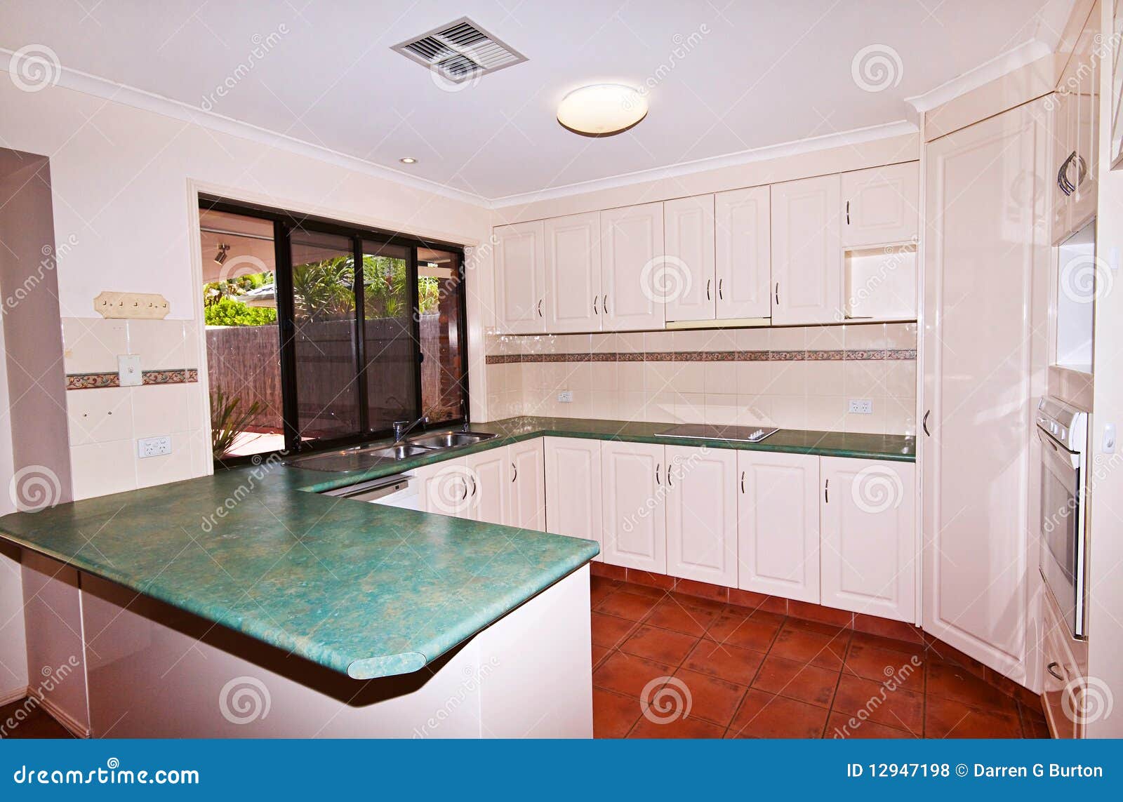 Modern Kitchen Overlooking Pool Stock Photo - Image of appliances ...