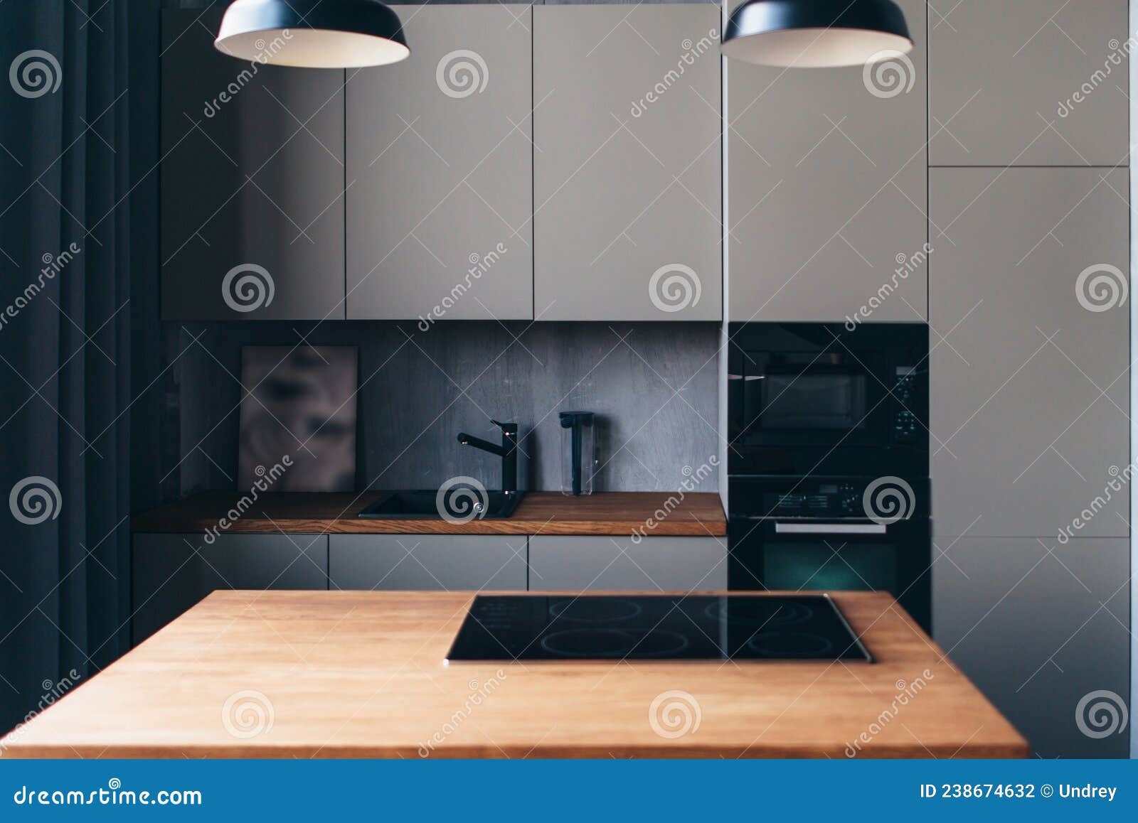 Modern Kitchen with Table and Built-in Hob. Interior Design Stock Photo ...