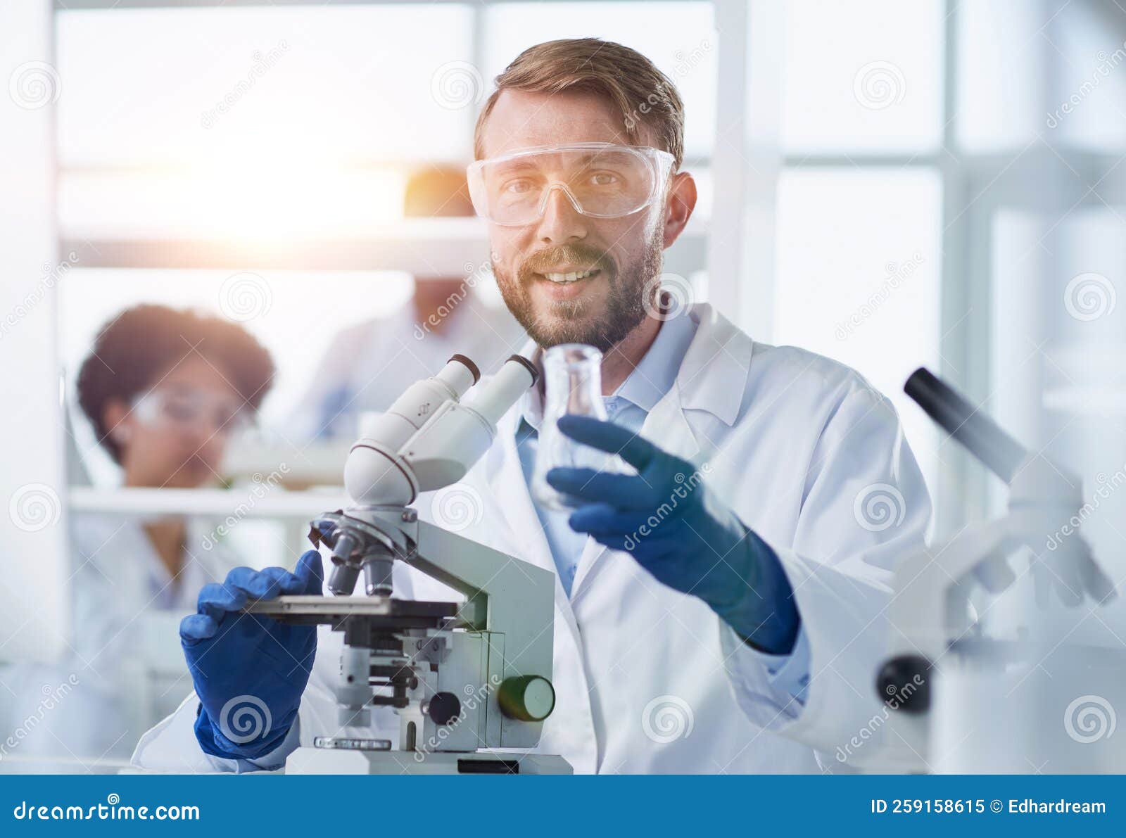 In a Modern Laboratory Research Scientist Conducts Experiments Stock ...