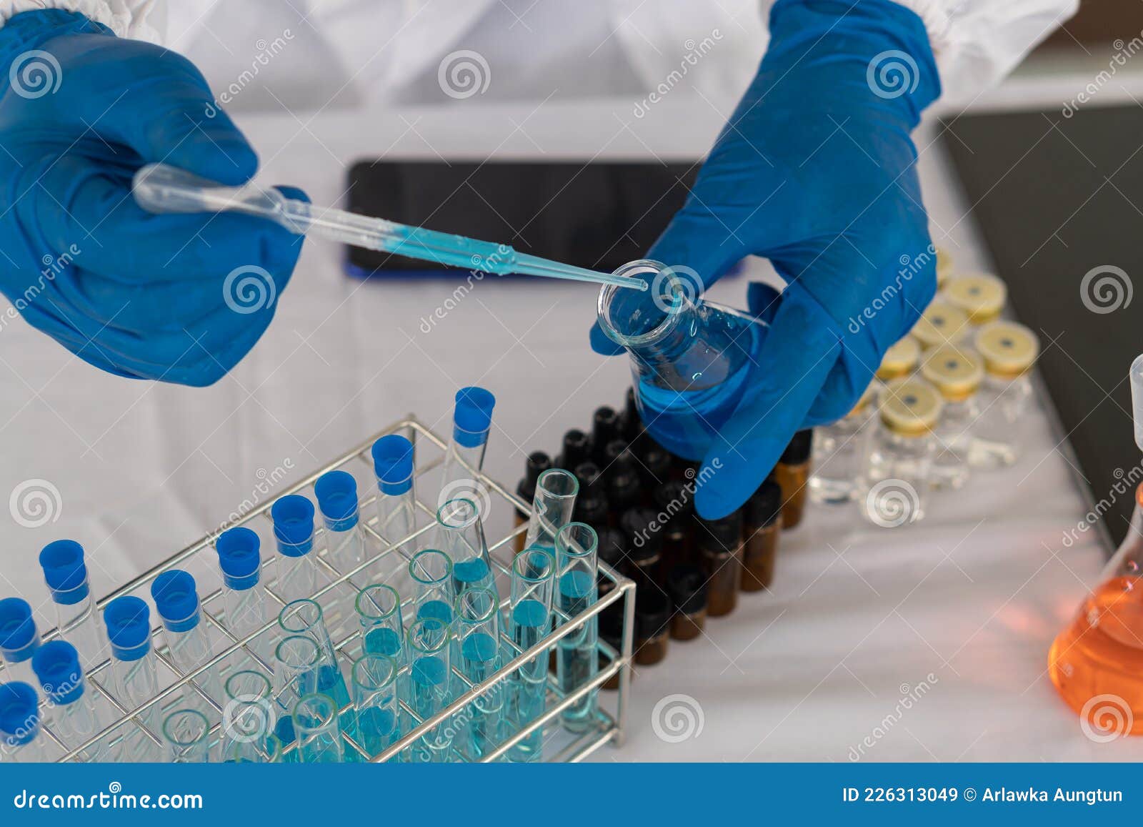 Modern Laboratory Scientists Conduct an Experiment by Synthesizing a ...