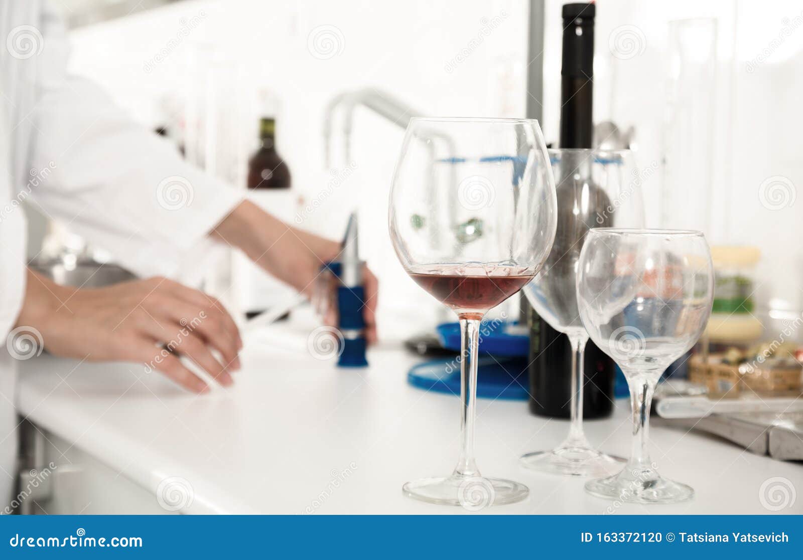 Modern Laboratory of Winery. Checking Acidity of Wine and Organoleptic ...