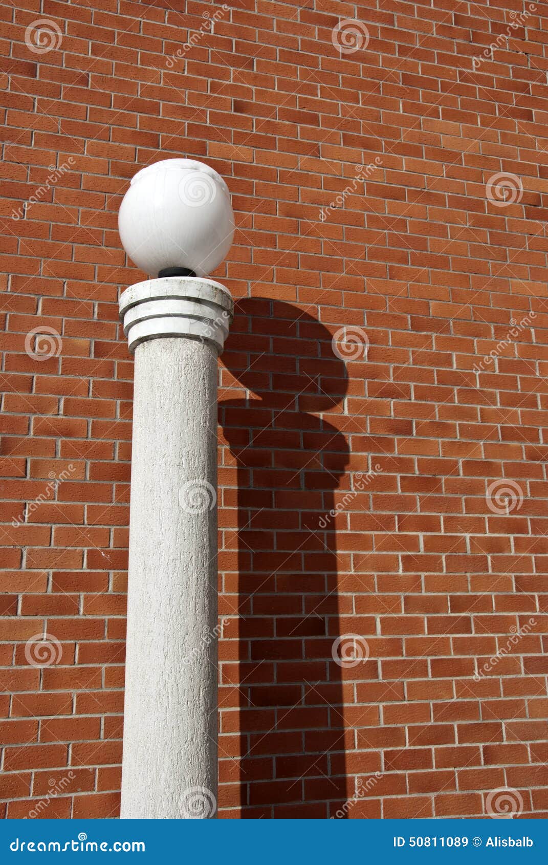 Modern Lamp on Column Near Red Brick Wall Stock Image - Image of wall ...