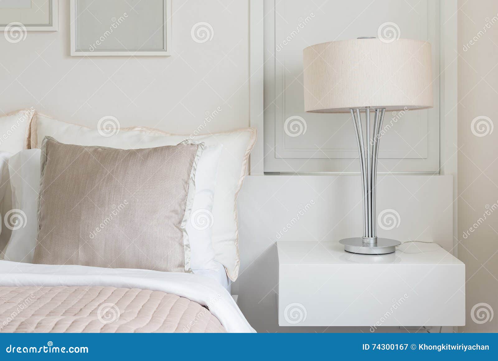 Modern Lamp on Table Side with Picture Frame on Wall in Bedroom Stock ...