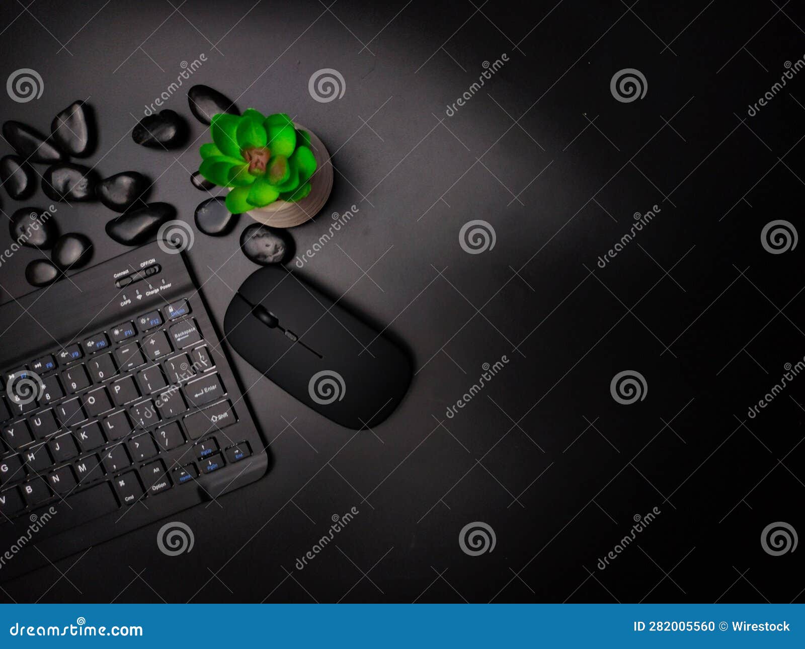 A Laptop Computer and Mouse on Top of a Table with Black Light Stock ...