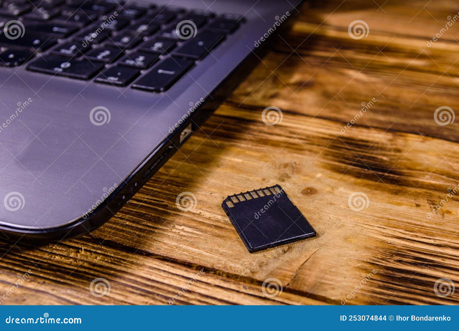 Modern Laptop and Sd Memory Card on a Wooden Desk Stock Photo - Image ...