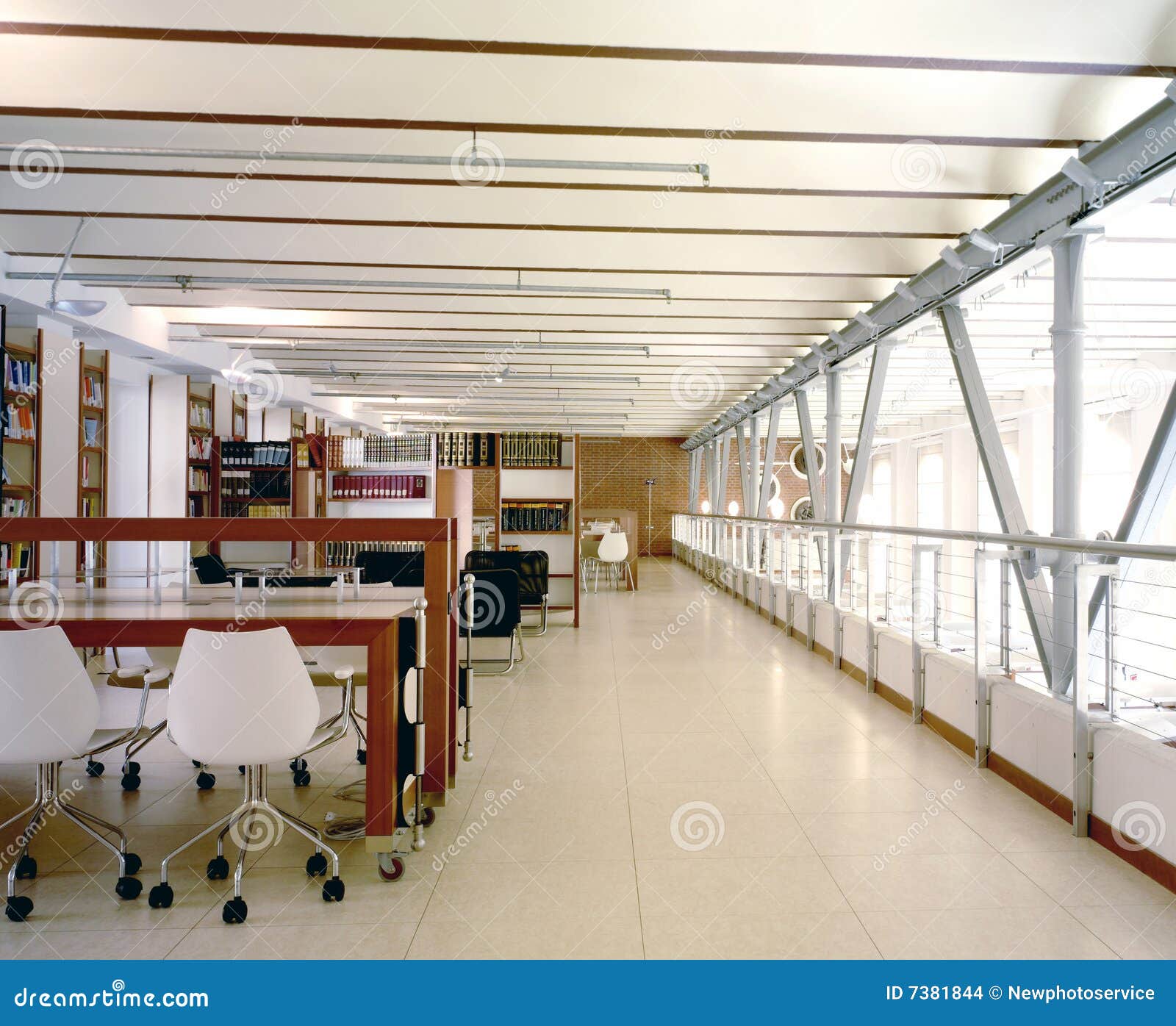 A Modern Library Featuring Sleek Shelves And Minimalist Design Royalty ...