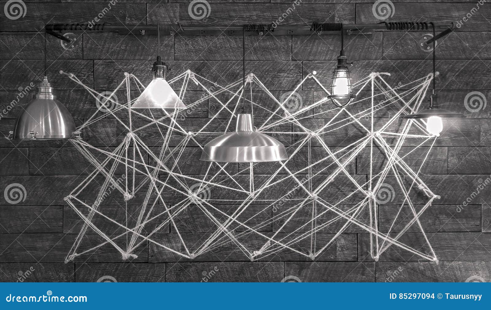 Modern Light Fixtures Hanging in Front of Complex Geometrical Design ...