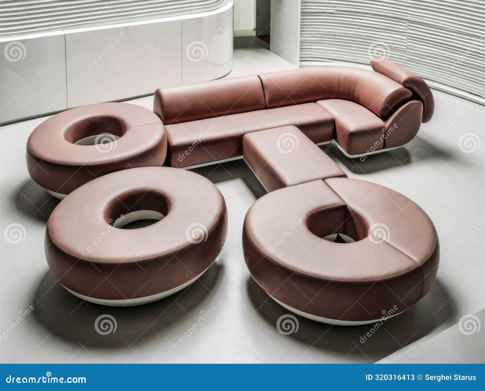 A Modern Looking Couch with Circular Cushions Like Donuts on a White ...