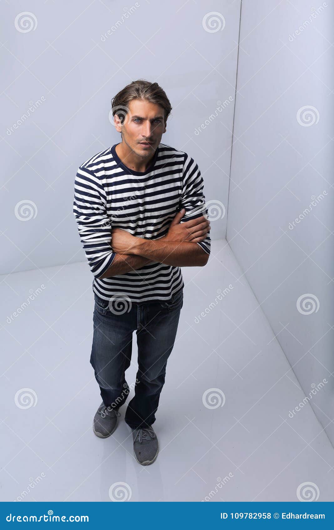 Modern Man Standing in the Corner of the White Room . Stock Photo ...