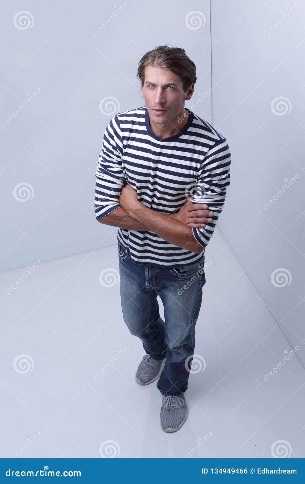 Modern Man Standing in the Corner of the White Room . Stock Photo ...