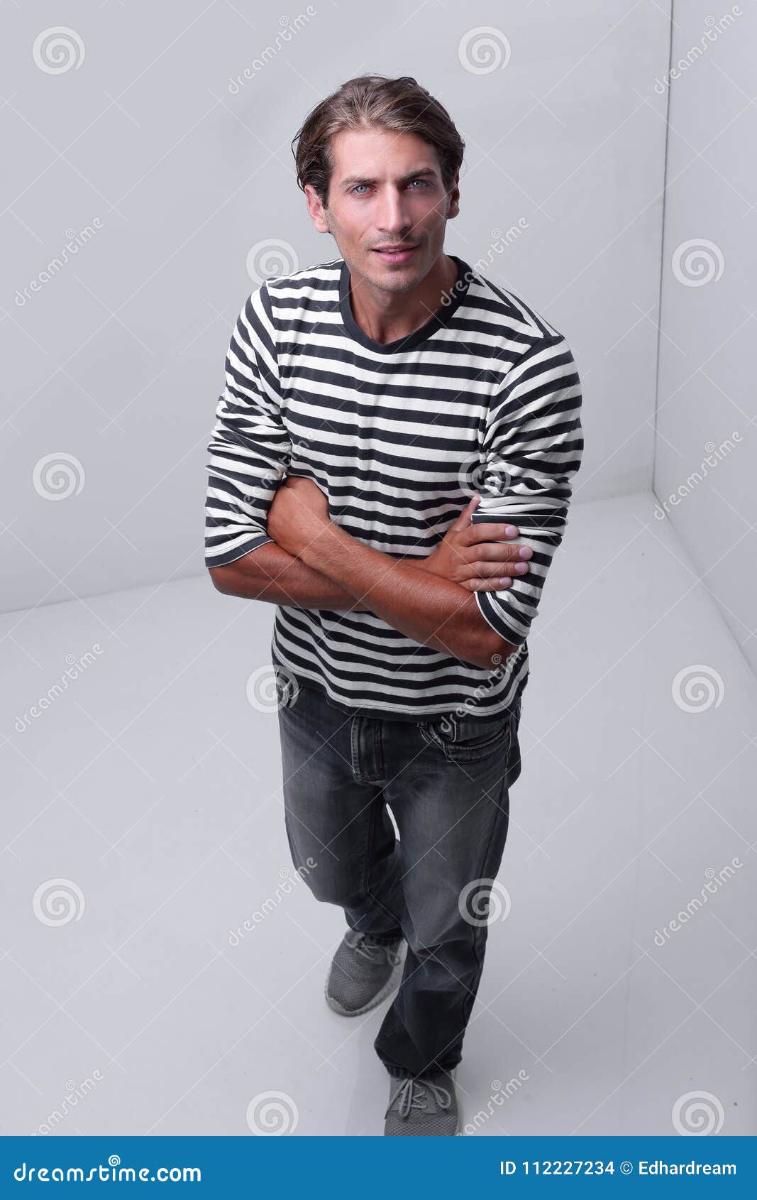 Modern Man Standing in the Corner of the White Room . Stock Photo ...