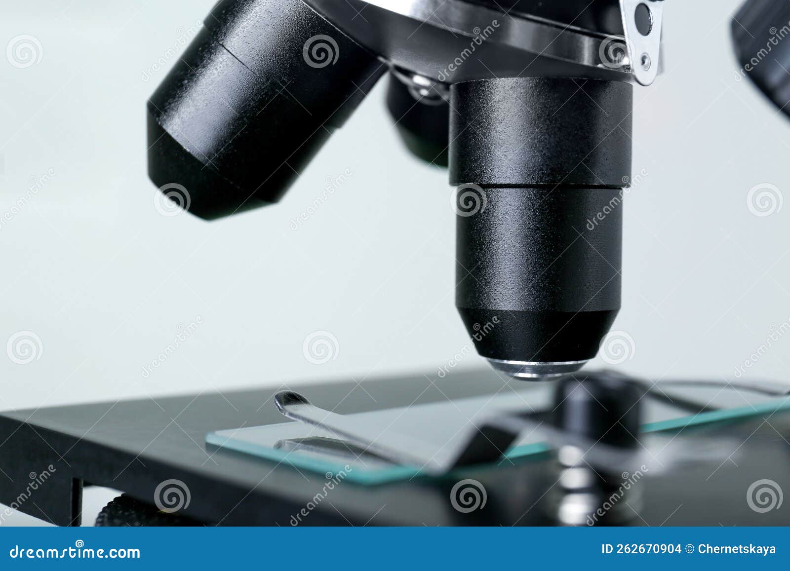 Modern Medical Microscope with Glass Slide on Grey Background, Closeup ...